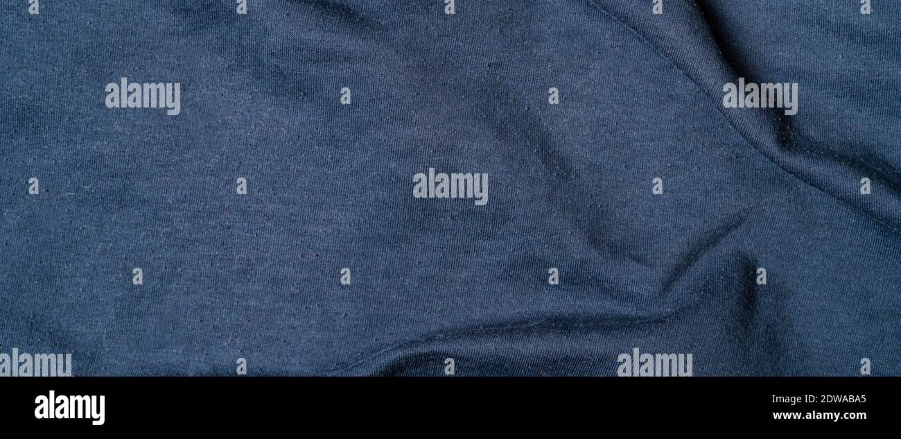 the wrinkled and crumpled waves of the colorful clothes textile texture ...