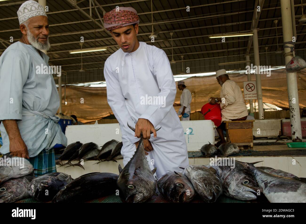 Tiwi, Oman. 26th May, 2014. Buying and selling of fish inside the ...