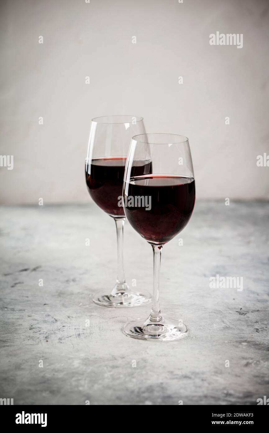 Red wine composition. Red wine glasses, bottle of wine, grapes and ...