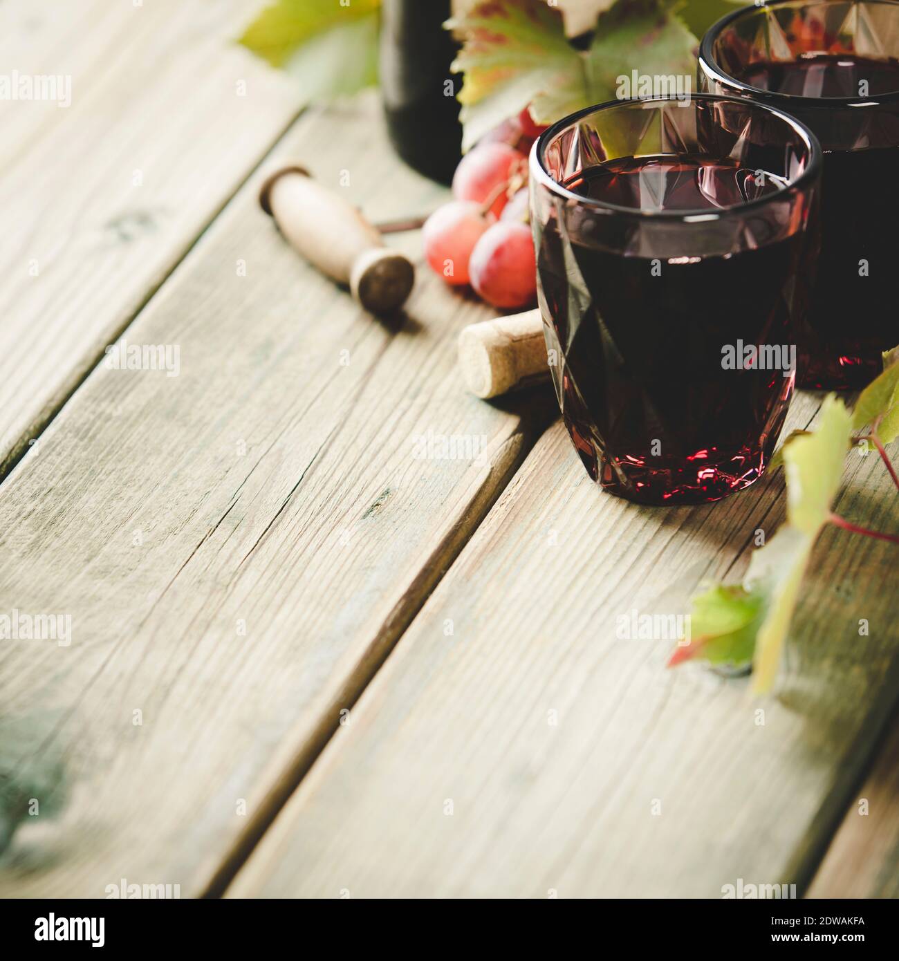 Red wine composition. Red wine glasses, bottle of wine, grapes and ...