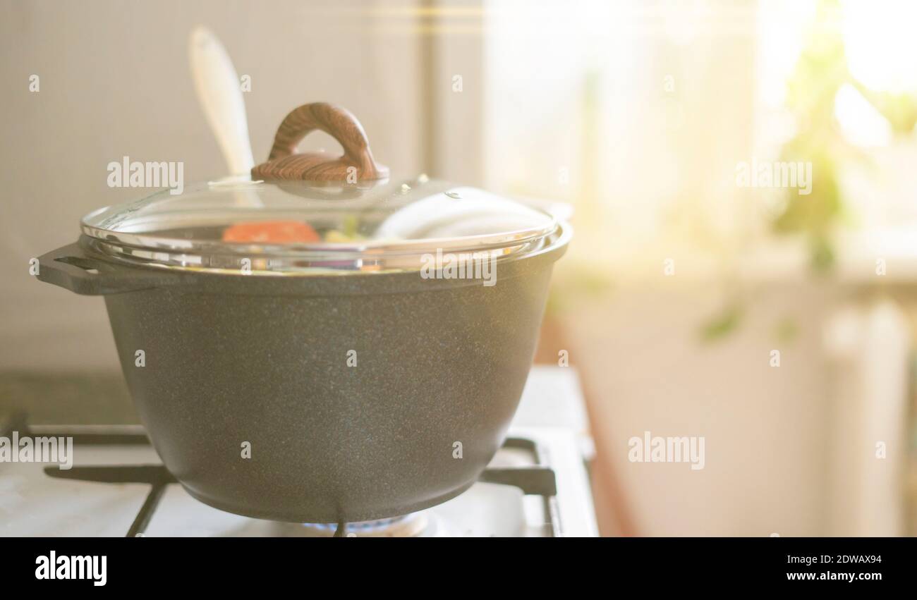 big pilaf pan bowl with mix of vegetables , cooking on the kitchen ...