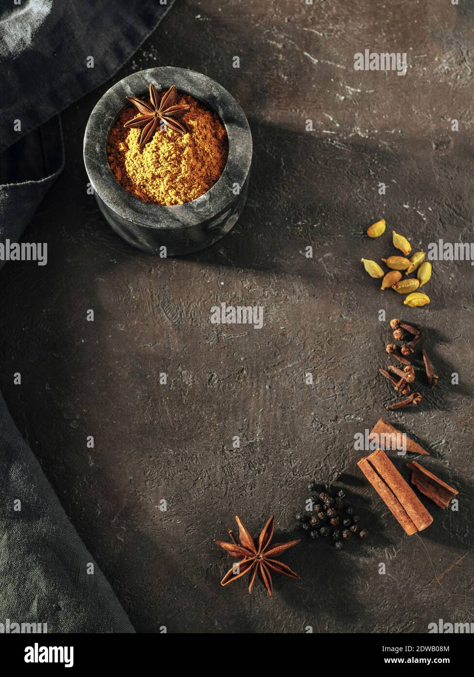 Indian or pakistani masala powder and spices on black backround. Small ...