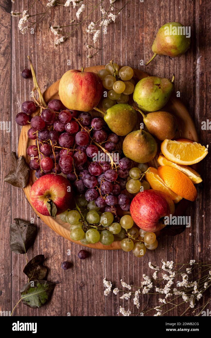 Wood tray with Fall fruits Stock Photo - Alamy