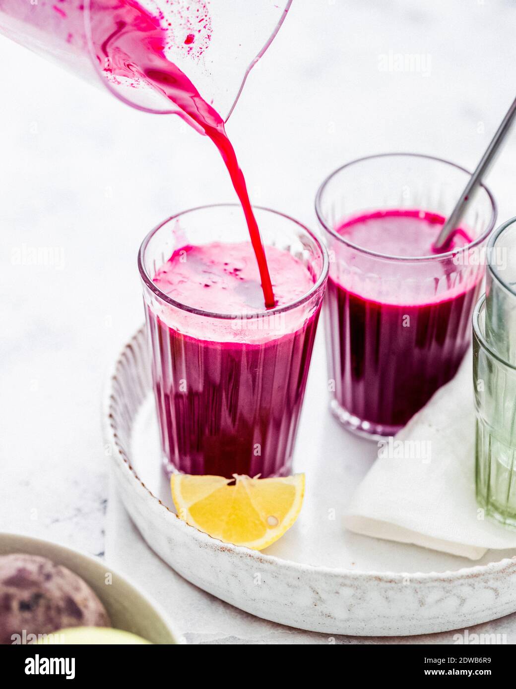 Lady pouring the Beetroot juice in the glass Stock Photo - Alamy
