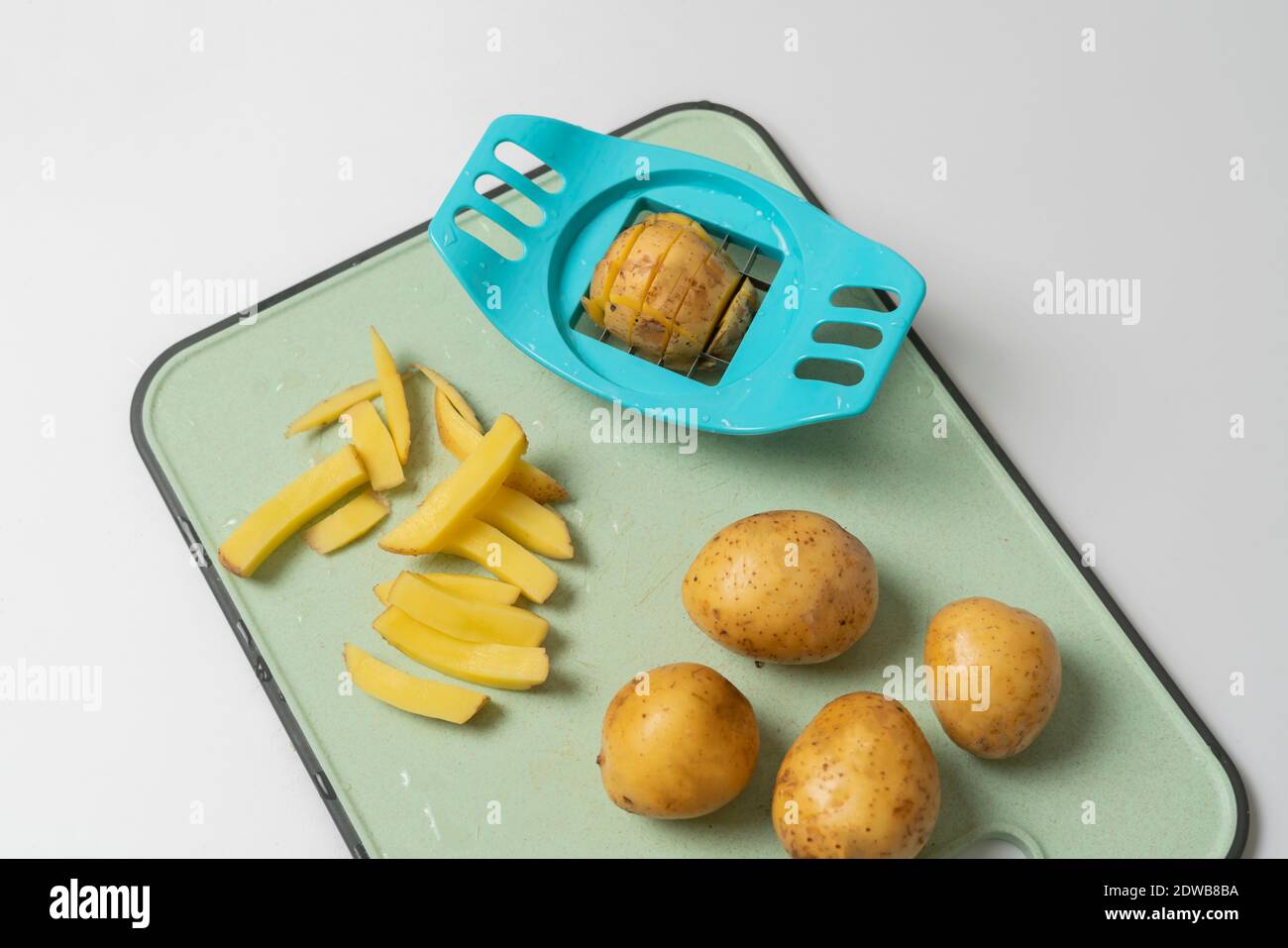 device potato push cutter. on the desk, making the rustic fried french ...