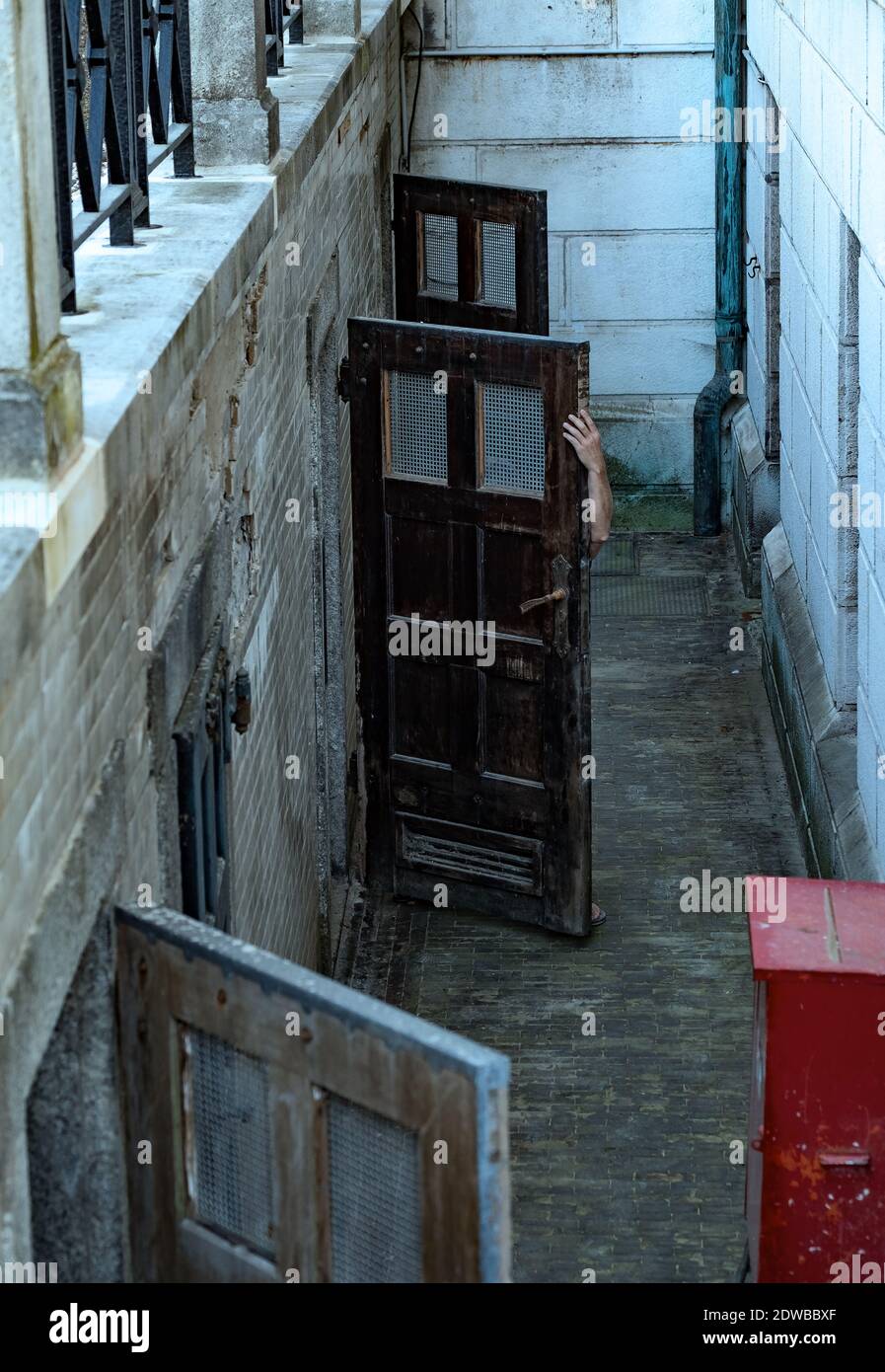 Man Hiding Behind Door High Resolution Stock Photography and Images - Alamy