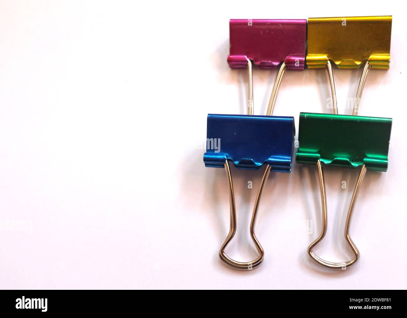 Multi Colored Paper Clips On White Background Stock Photo - Alamy