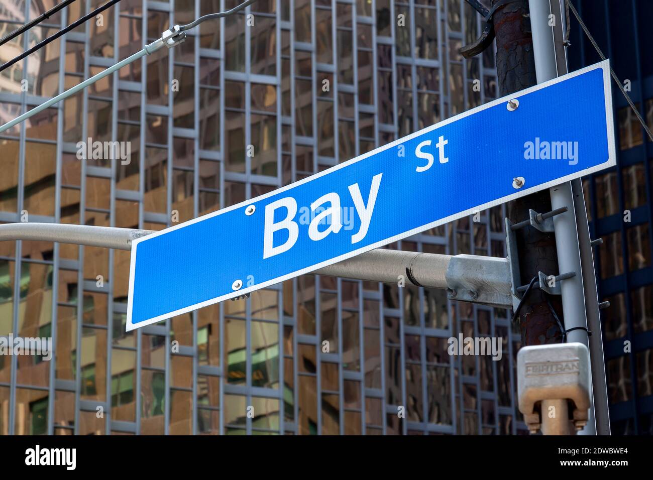 Bay Street sign with glass wall of a bank building background Stock ...