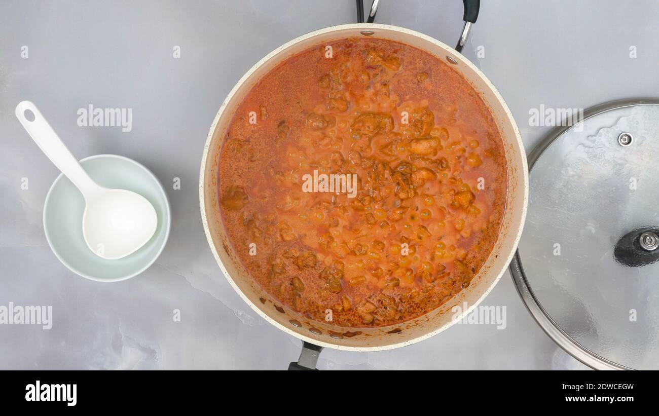 Chopped chicken meat with paprika and sour cream sauce close up on ...