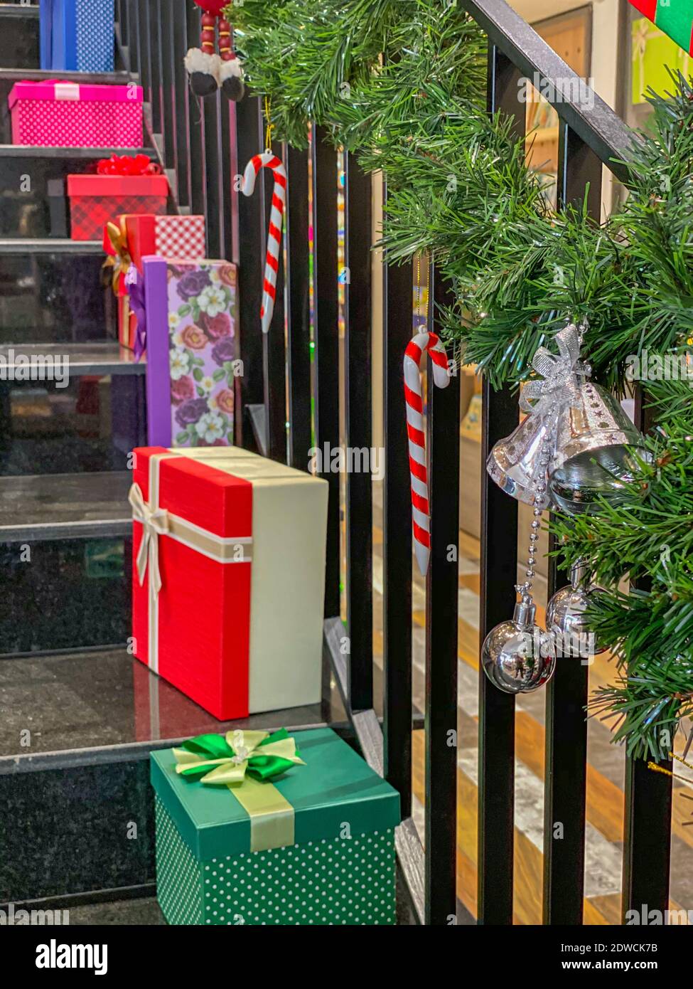 Vertical photo of Christmas gift boxes on the stair steps Stock Photo ...