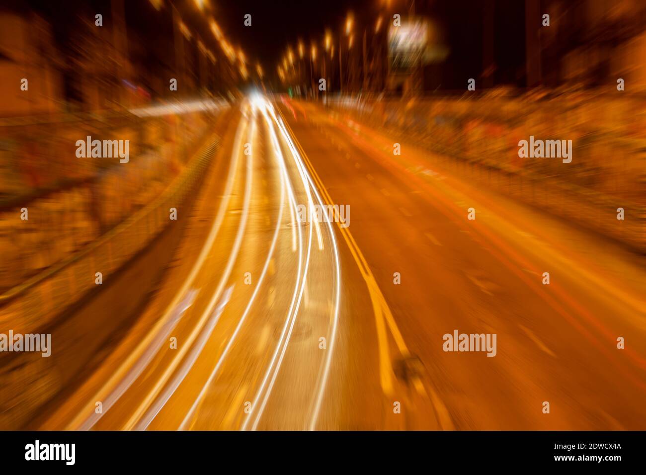 Blurred background of a section of the road. Defocused night city road ...