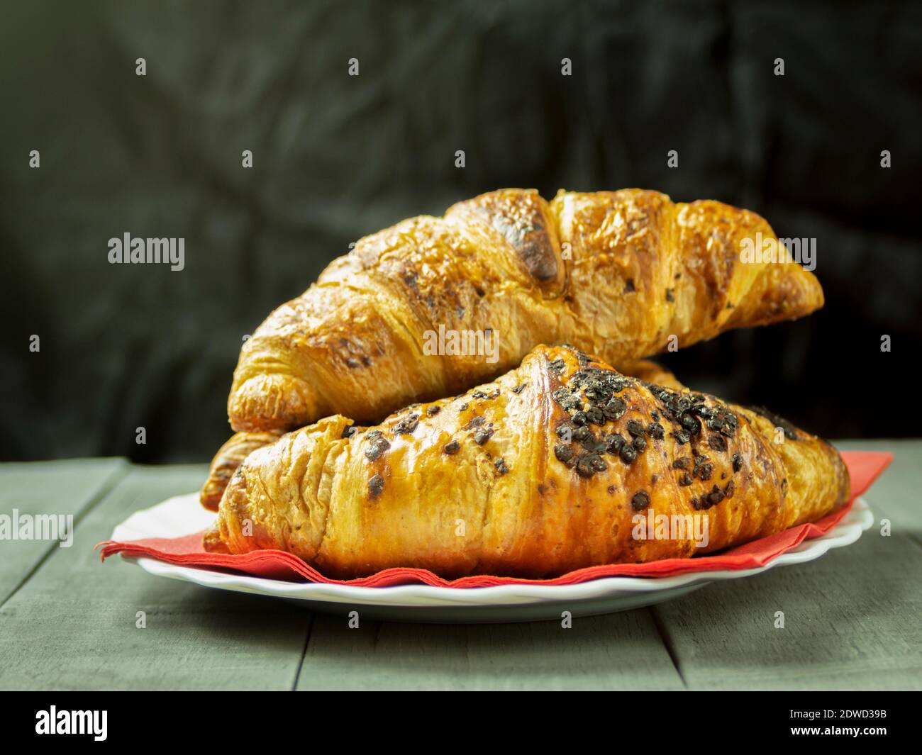 Delicious croissant with chocolate filling as background. Fresh and ...