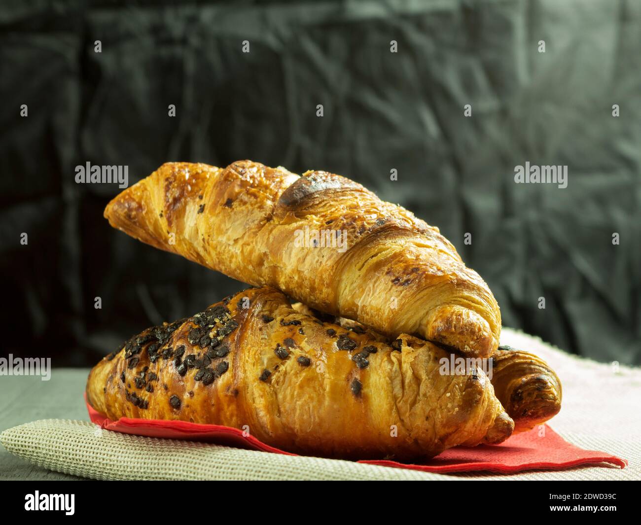 Delicious croissant with chocolate filling as background. Fresh and ...