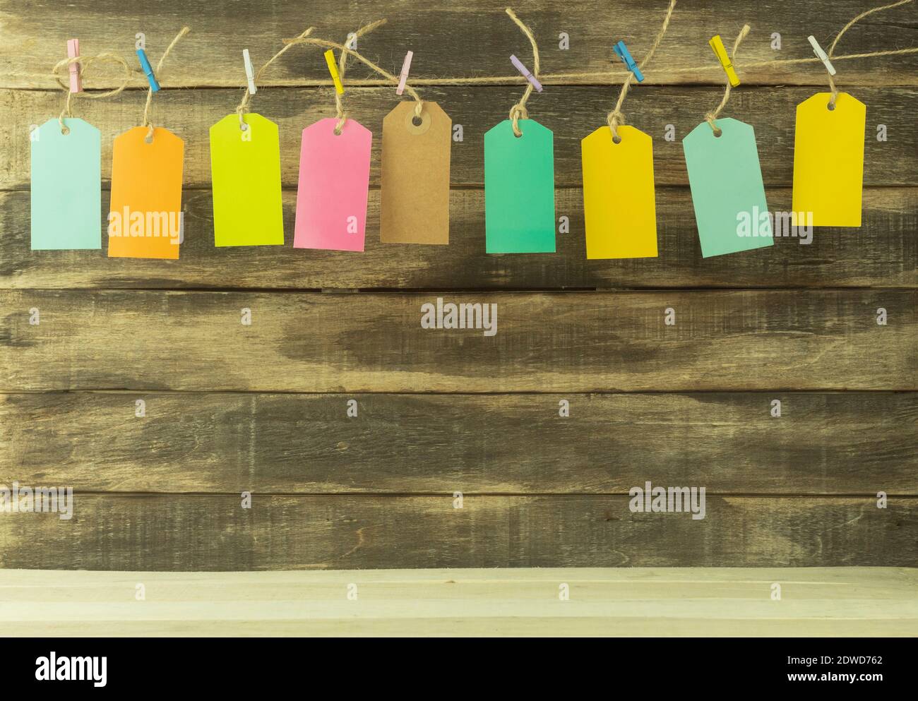 Labels in different colors as a background. Rope tags as background ...