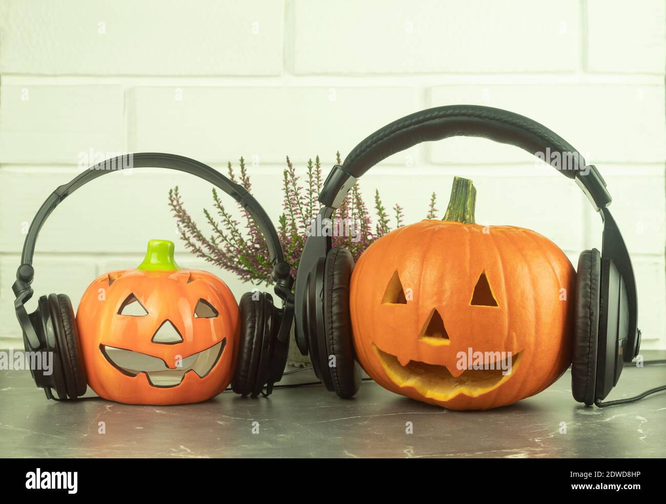 Pumpkin with headphones on the kitchen table. Concept idea for a ...