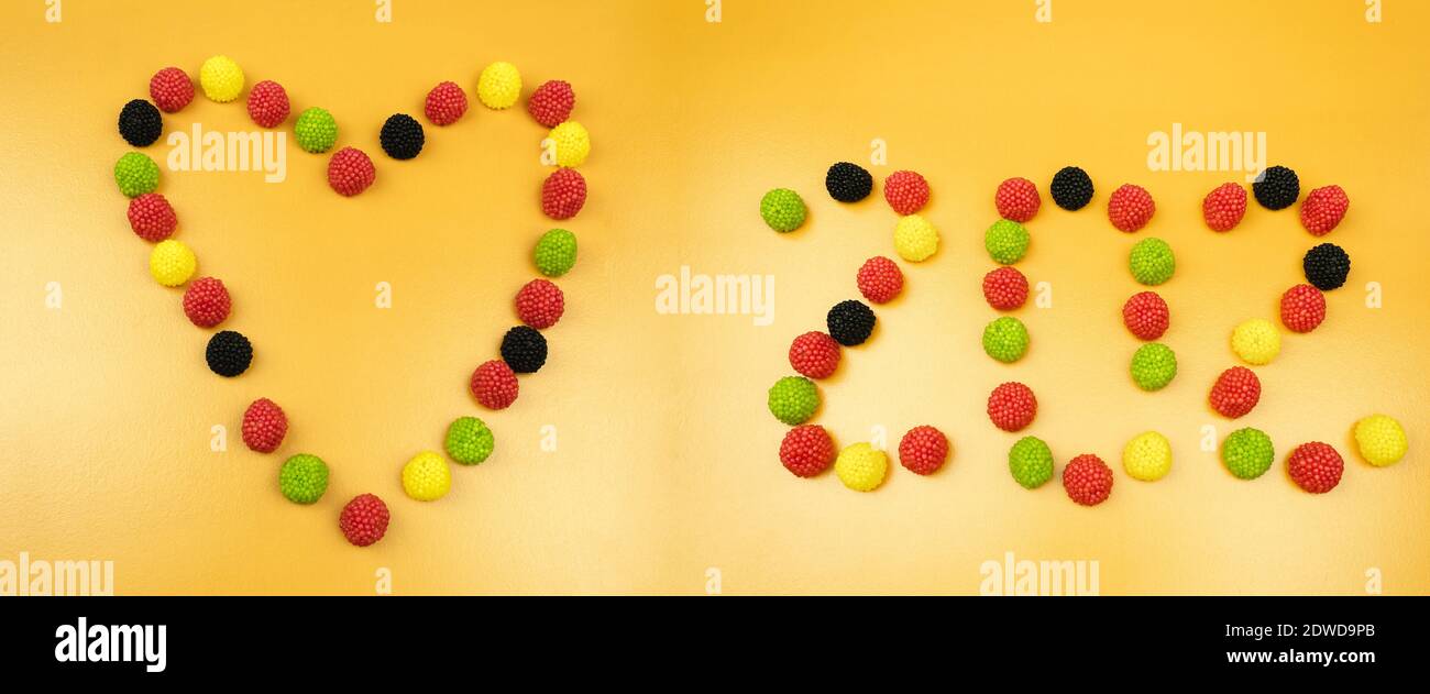 The word sos and the heart are lined with colorful candies Stock Photo ...