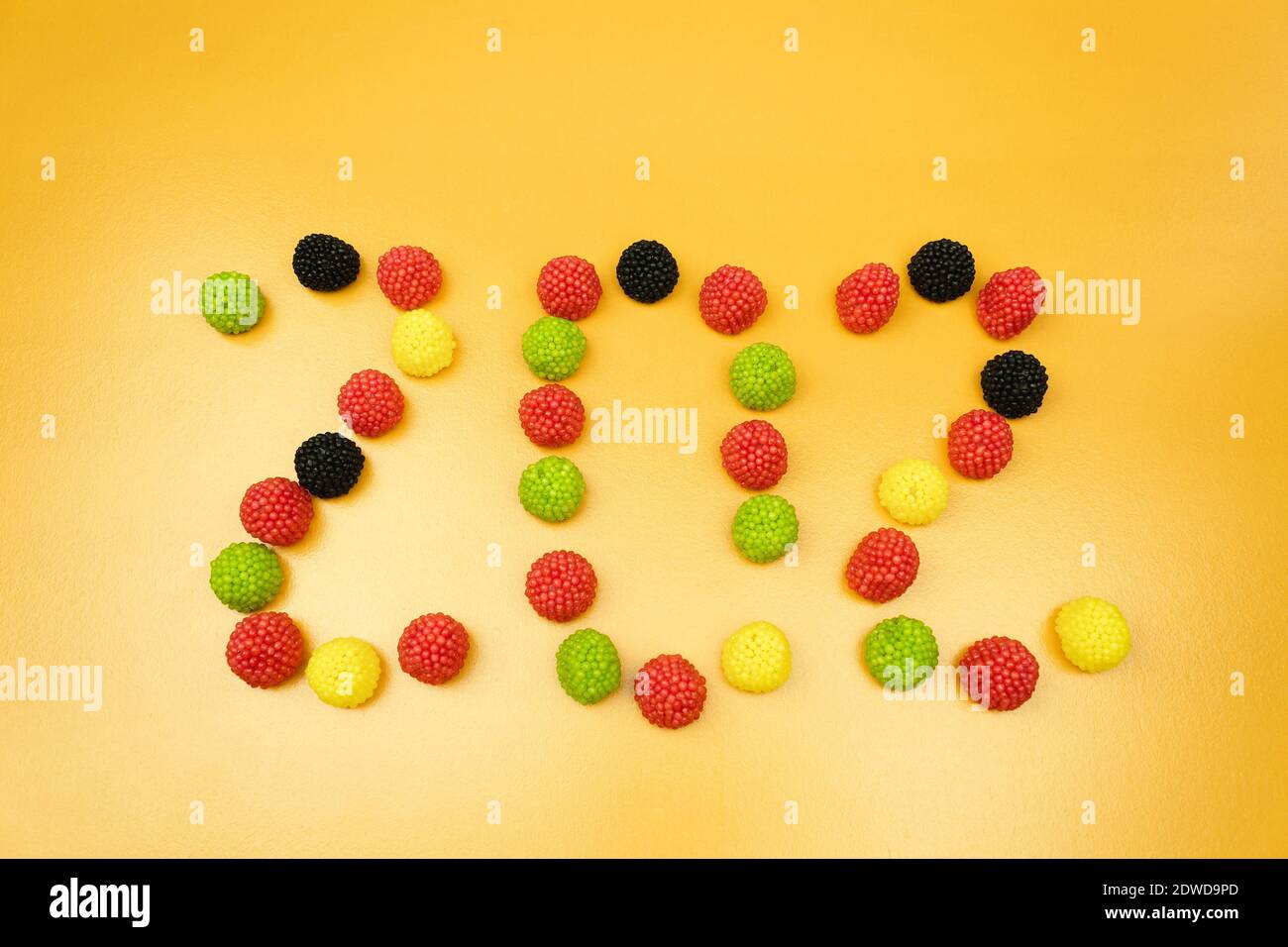 The word sos is lined with colorful candies Stock Photo - Alamy