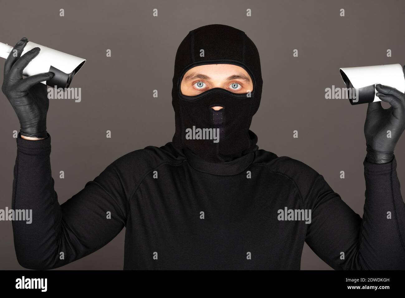 Thief wearing robbery mask trying hi-res stock photography and images ...
