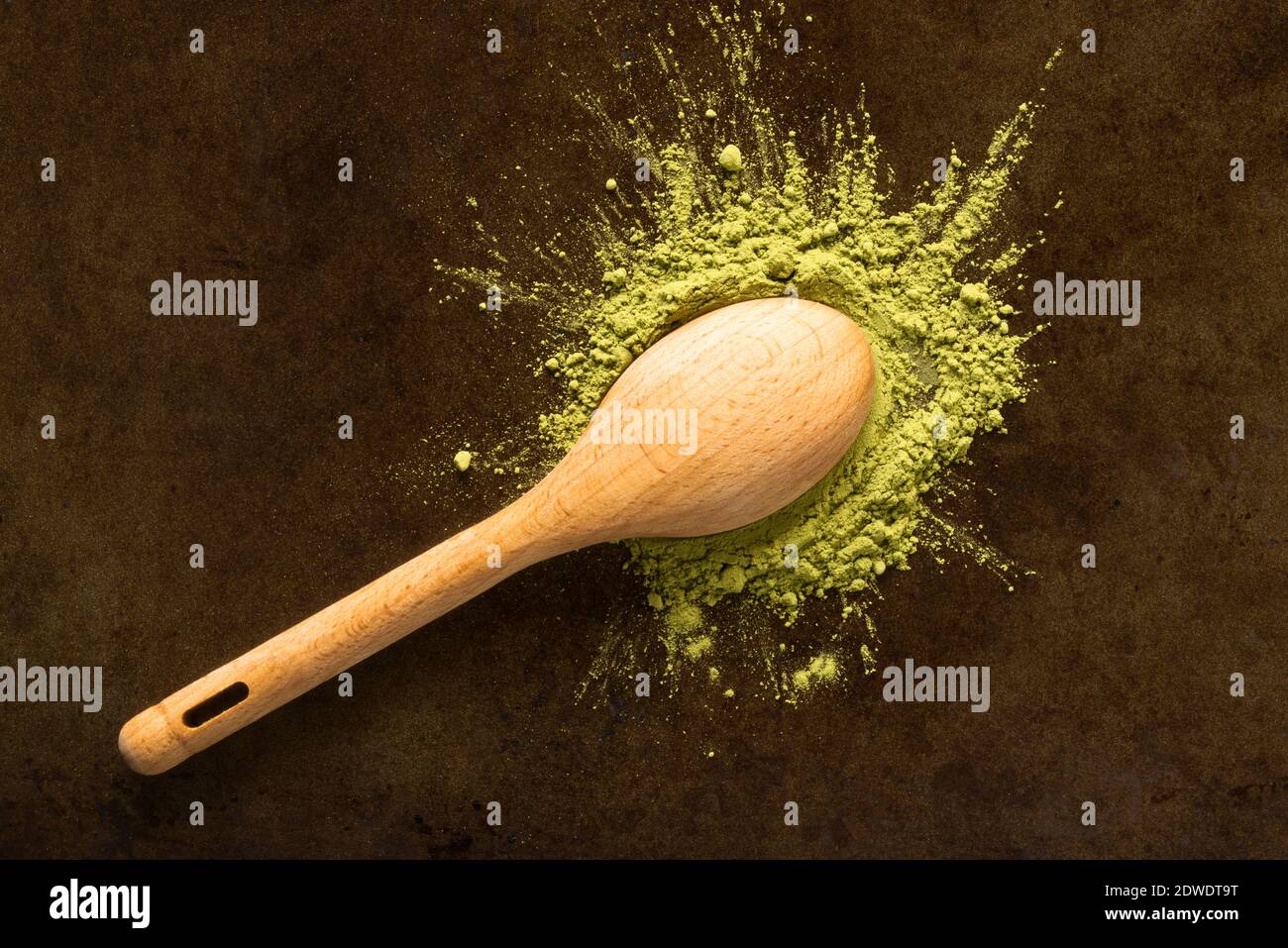 Matcha Tea Powder Dpilled From A Spoon Stock Photo - Alamy