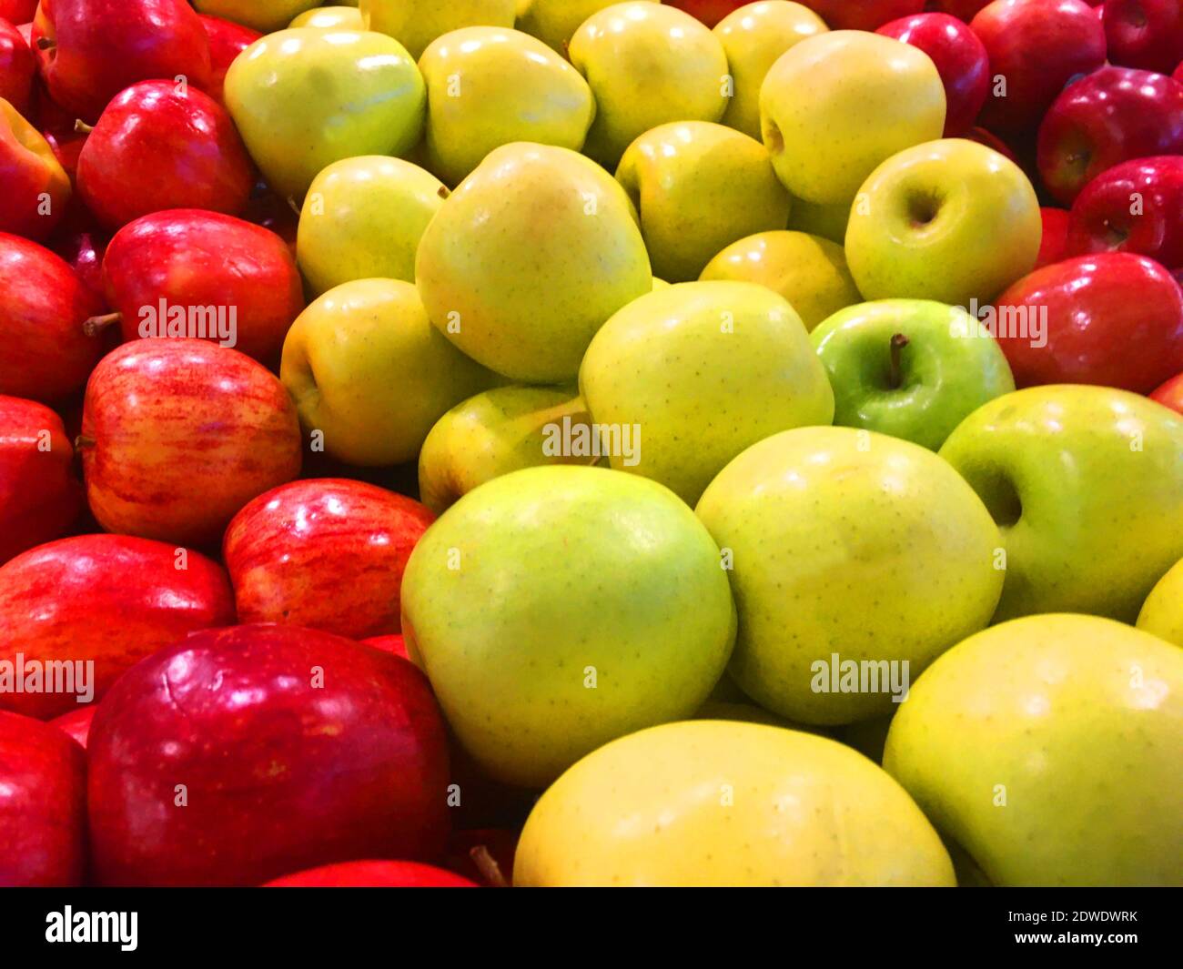 Rows of apples red golden and granny smith colorful red green red front ...