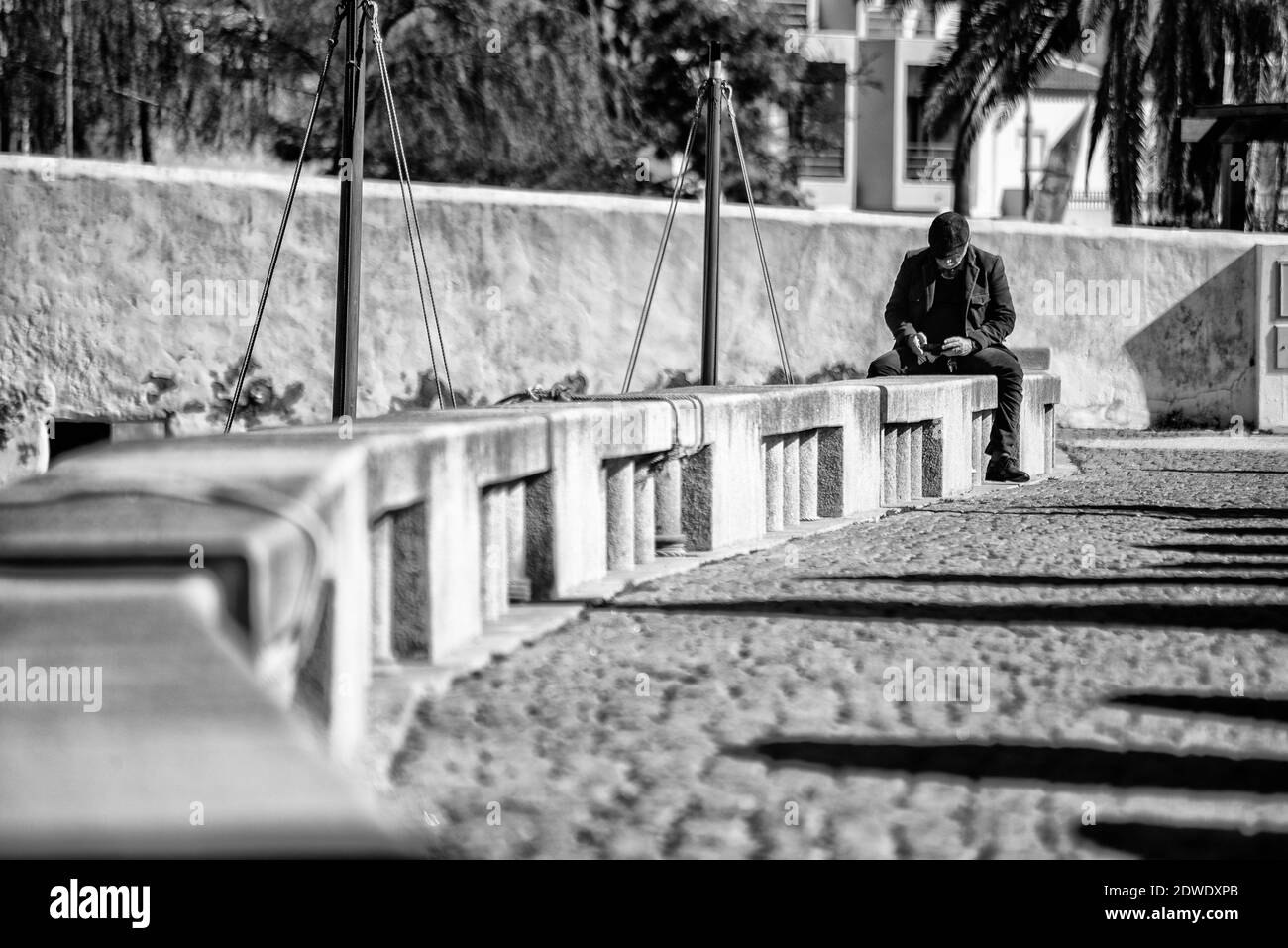 Senior man sitting on railing at hi-res stock photography and images ...