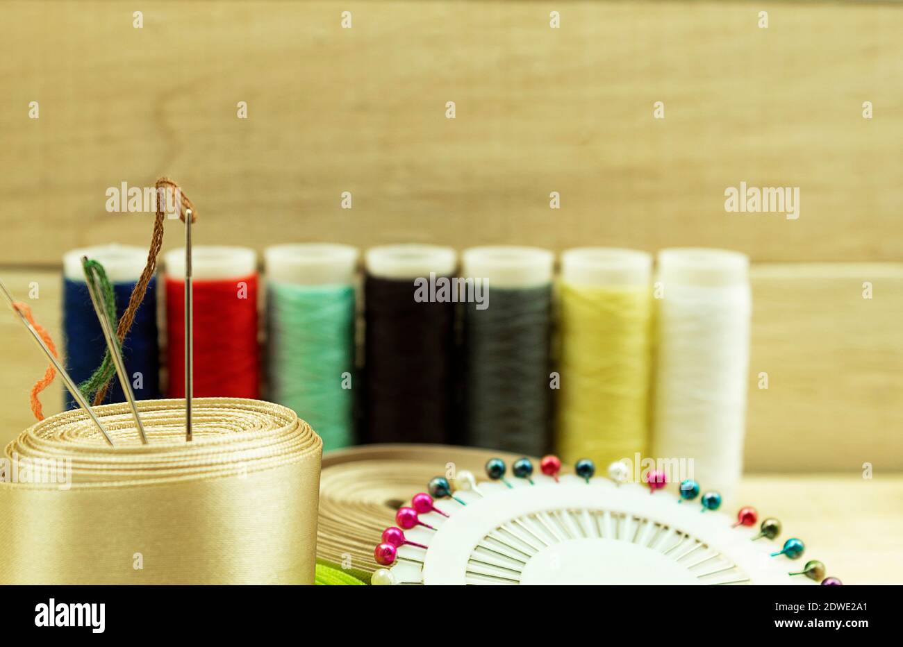 Threads of different colors for embroidery. Needle and thread as ...