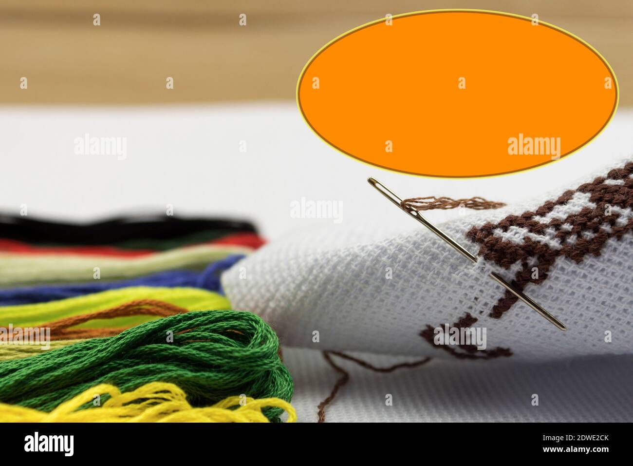 Threads of different colors for embroidery. Needle and thread as ...