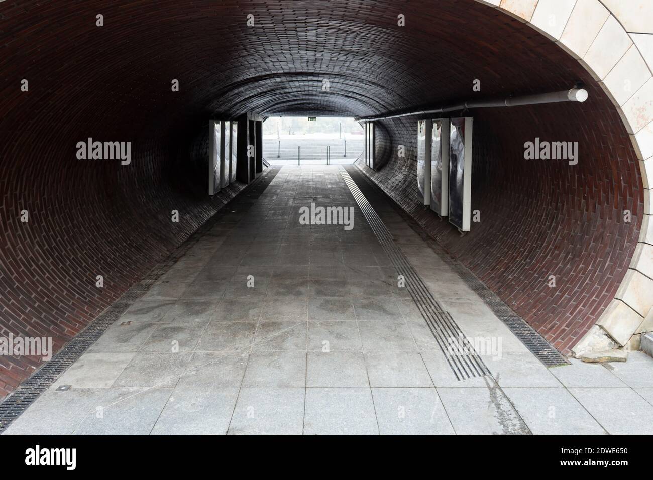 A pedestrian crossing in the form of a tunnel. Arched underground ...