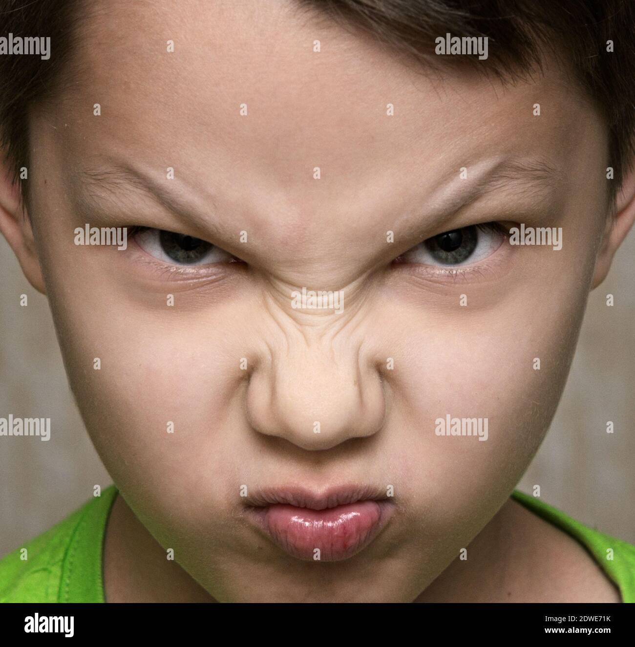 Portrait of angry boy Stock Photo - Alamy