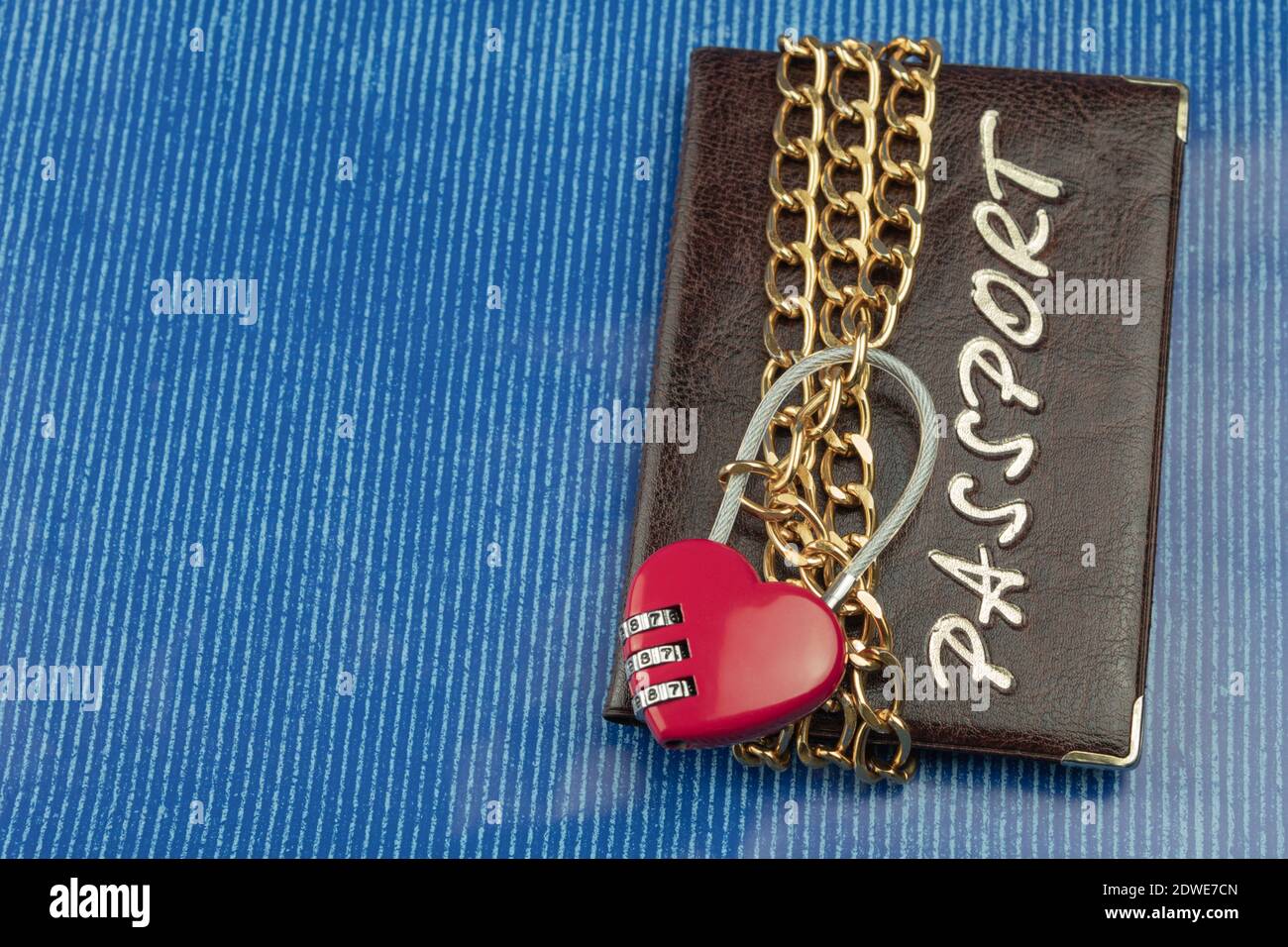 Chain with a heart-shaped lock on the passport. Code lock with chain on ...