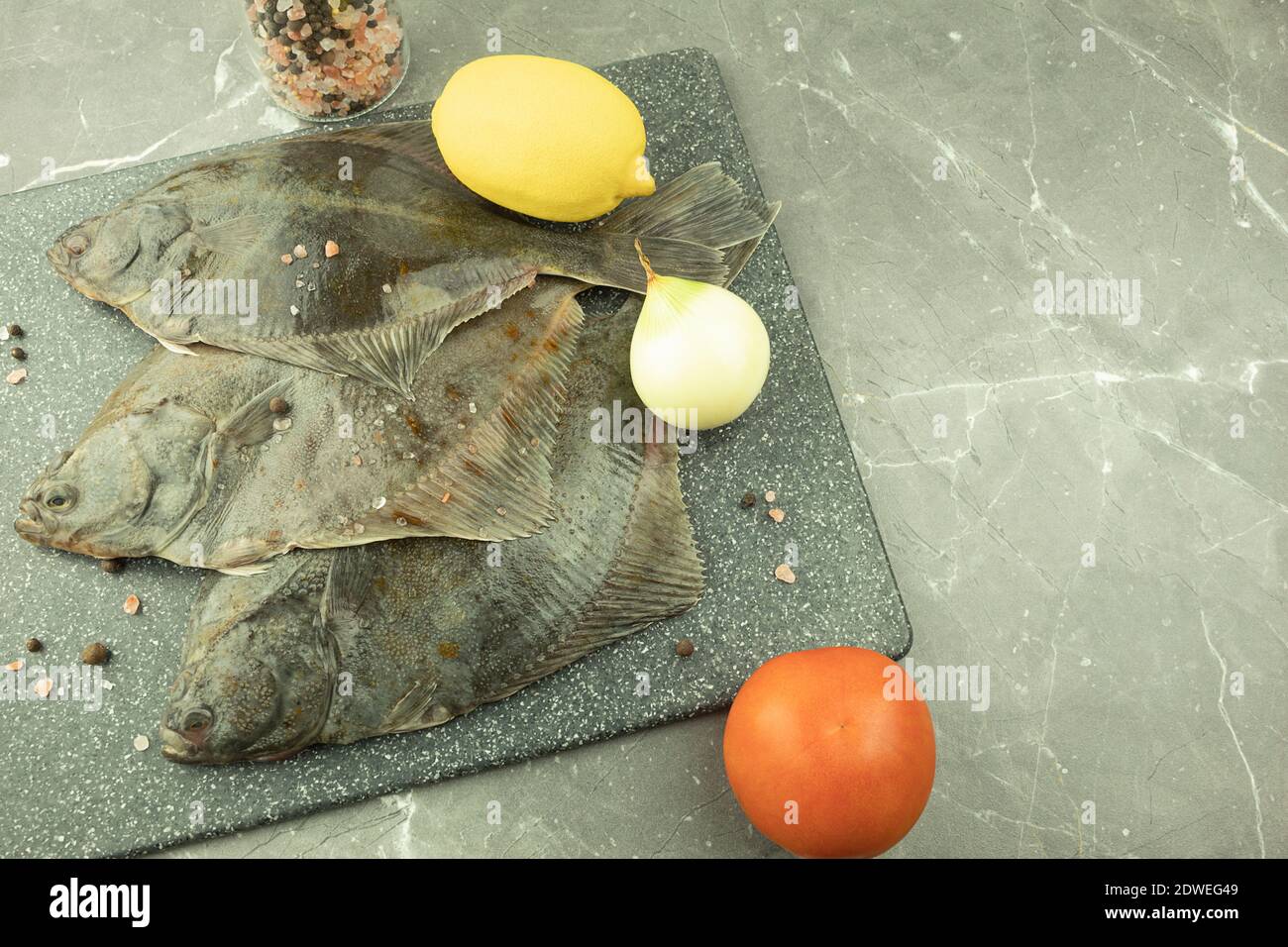Fresh flounder peeled and prepared for cooking with spices. Chilled ...