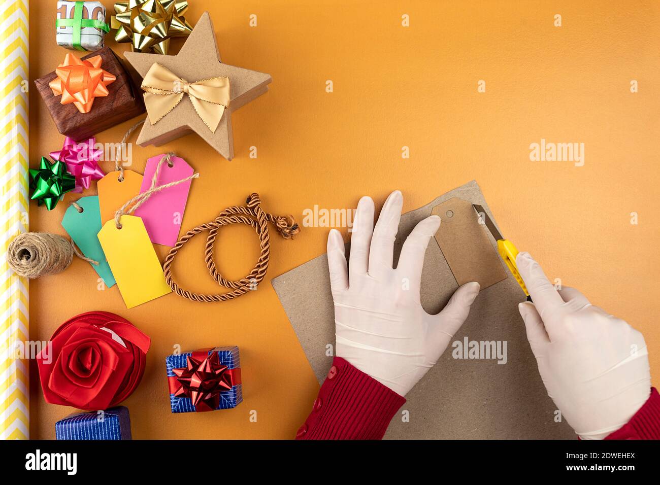 Gift boxes and wrapping paper on the table. Gift wrapping process ...