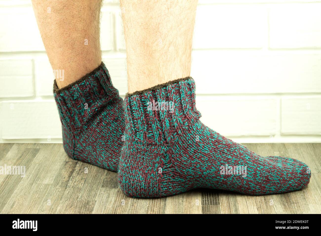 Handmade socks, warm and do-it-yourself knitted socks close-up. Photo ...