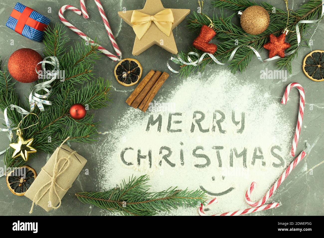 Merry christmas text is written on flour while baking cookies. Text ...