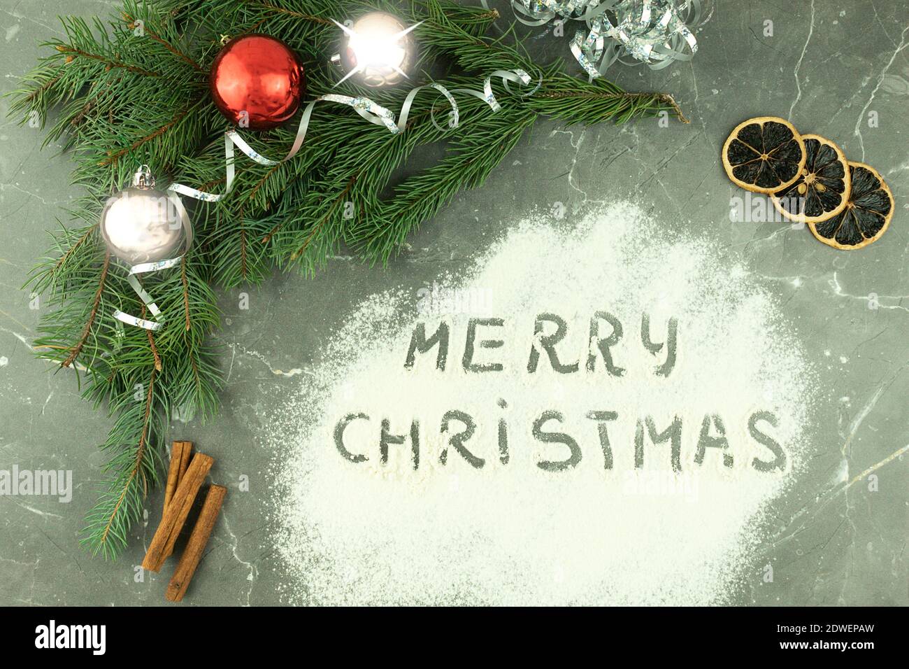 Merry christmas text is written on flour while baking cookies. Text ...