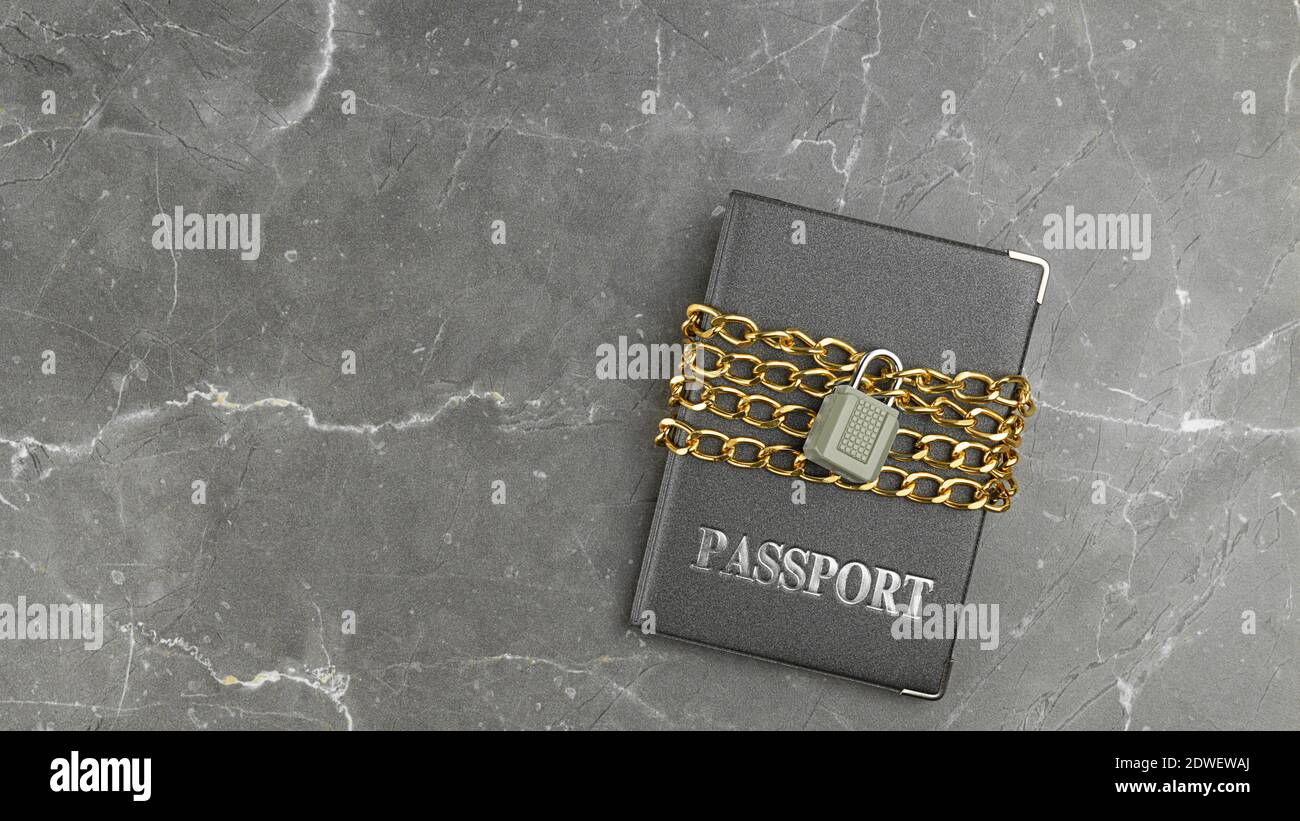 Travel ban concept, Passport wrapped in a chain with a lock. Passport ...