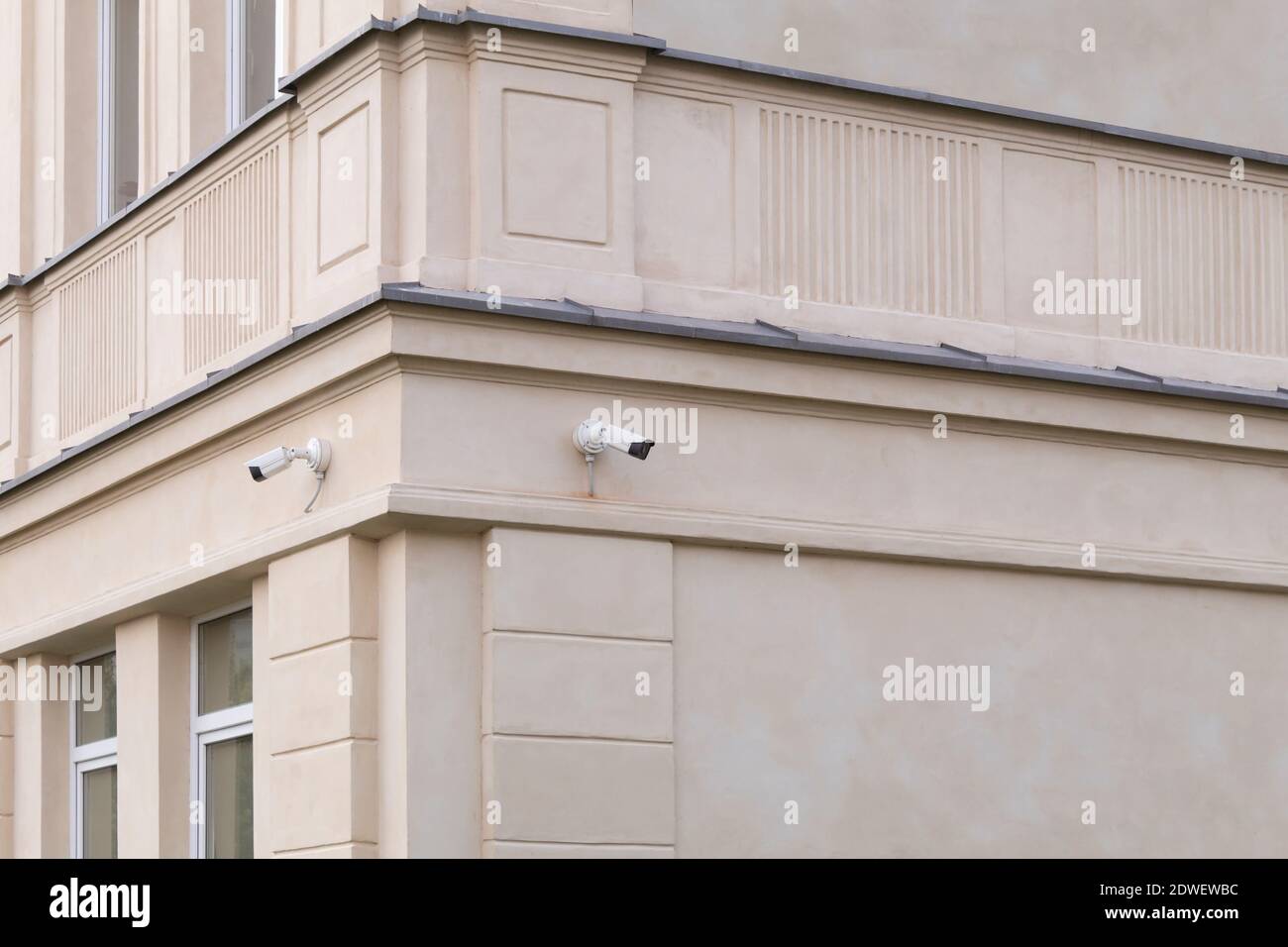 Two CCTV cameras on the corner of the house. Surveillance camera on the ...
