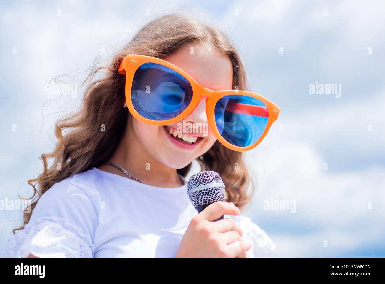 cheerful child singer singing in microphone music style, vocal Stock ...