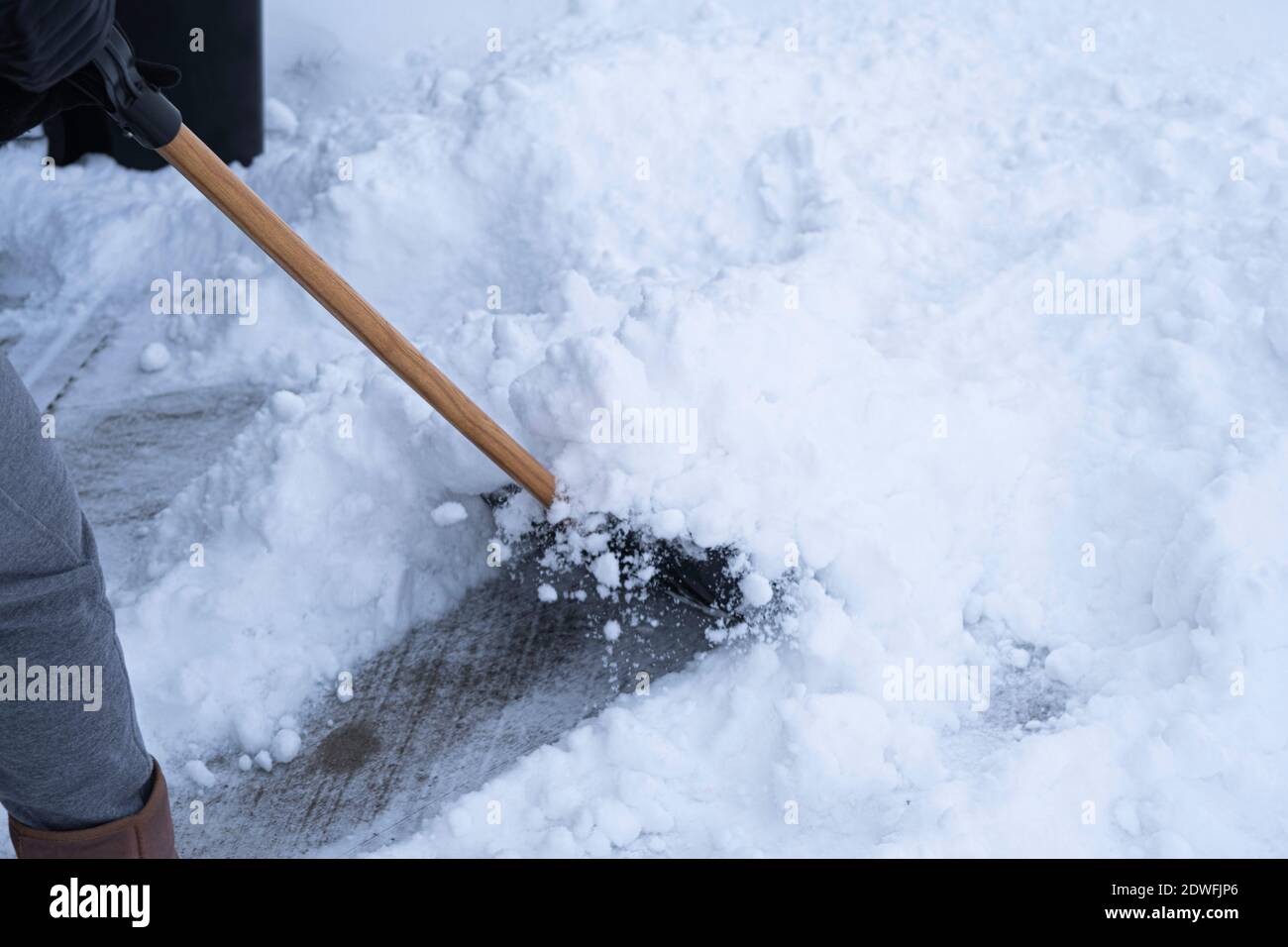 Clearing snow from driveway after heavy winter storm Stock Photo - Alamy