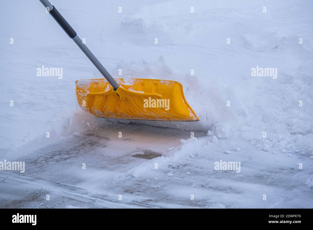 Clearing snow from driveway after heavy winter storm Stock Photo - Alamy