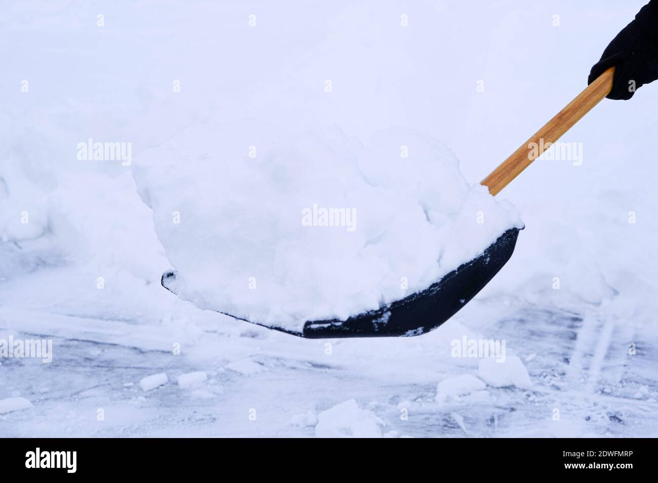 Clearing snow from driveway after heavy winter storm Stock Photo - Alamy