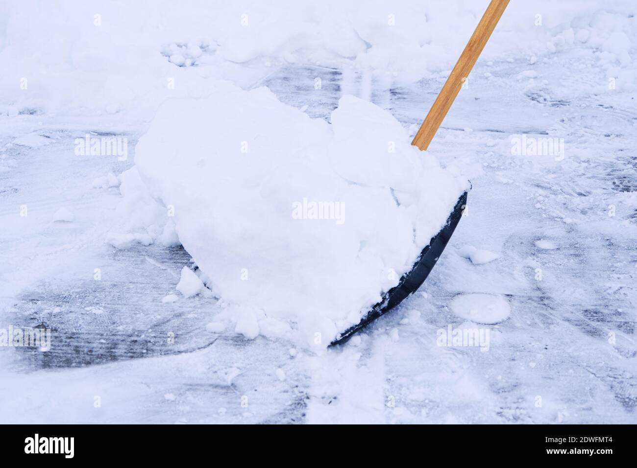 Clearing snow from driveway after heavy winter storm Stock Photo - Alamy