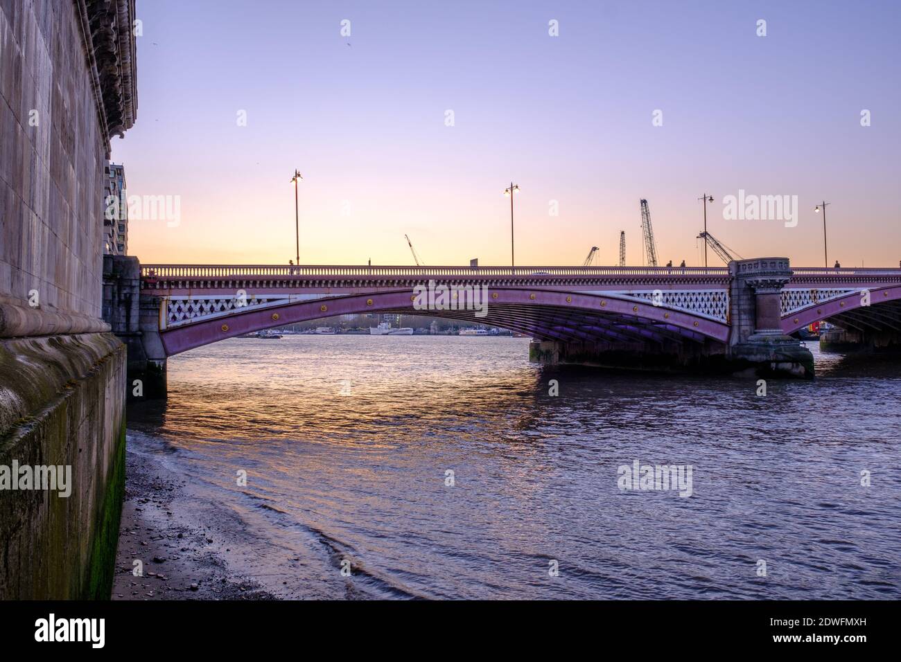 London city centre and its buildings during a pink sunset in a clear ...