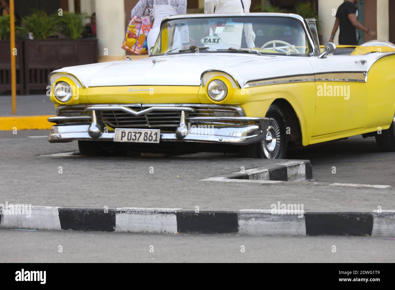 Parked yellow vintage car, Havana, Cuba Stock Photo - Alamy