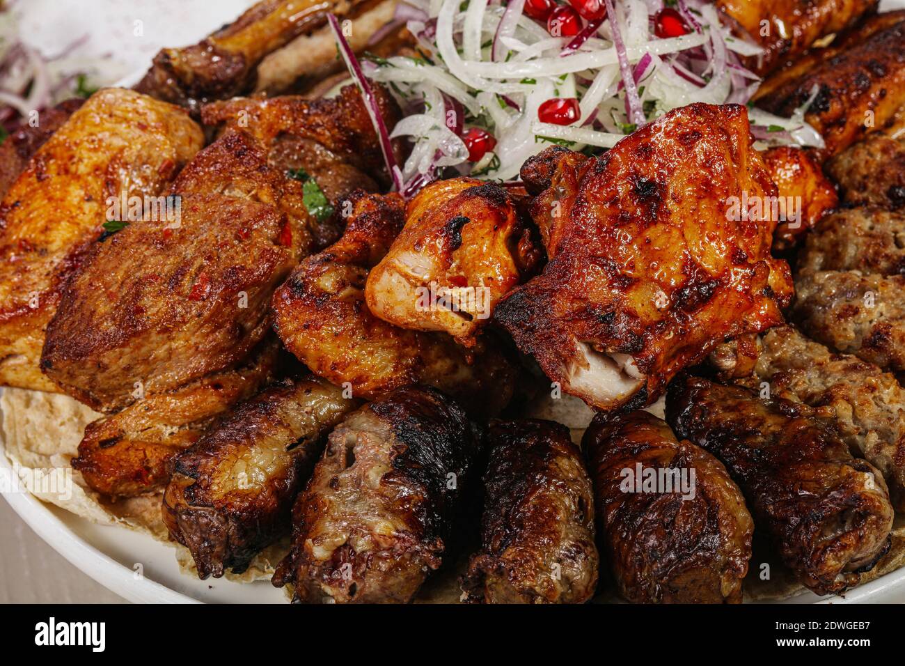 Caucasian shashlik plate with grilled meat - beef, lamb. chicken and ...