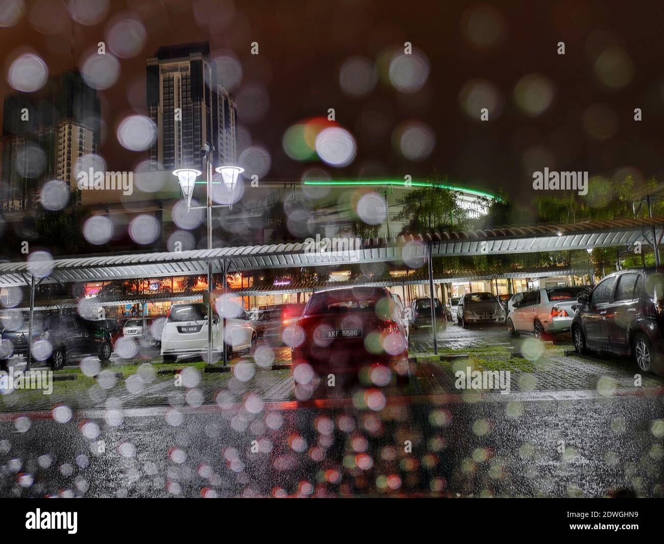 City through rainy window at night hi-res stock photography and images ...