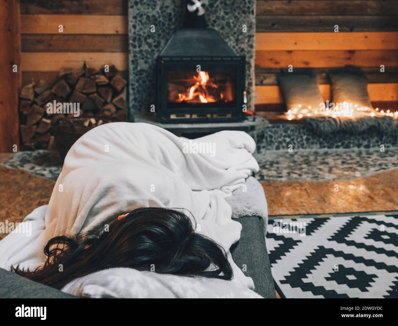 Woman sleeping fireplace hi-res stock photography and images - Alamy