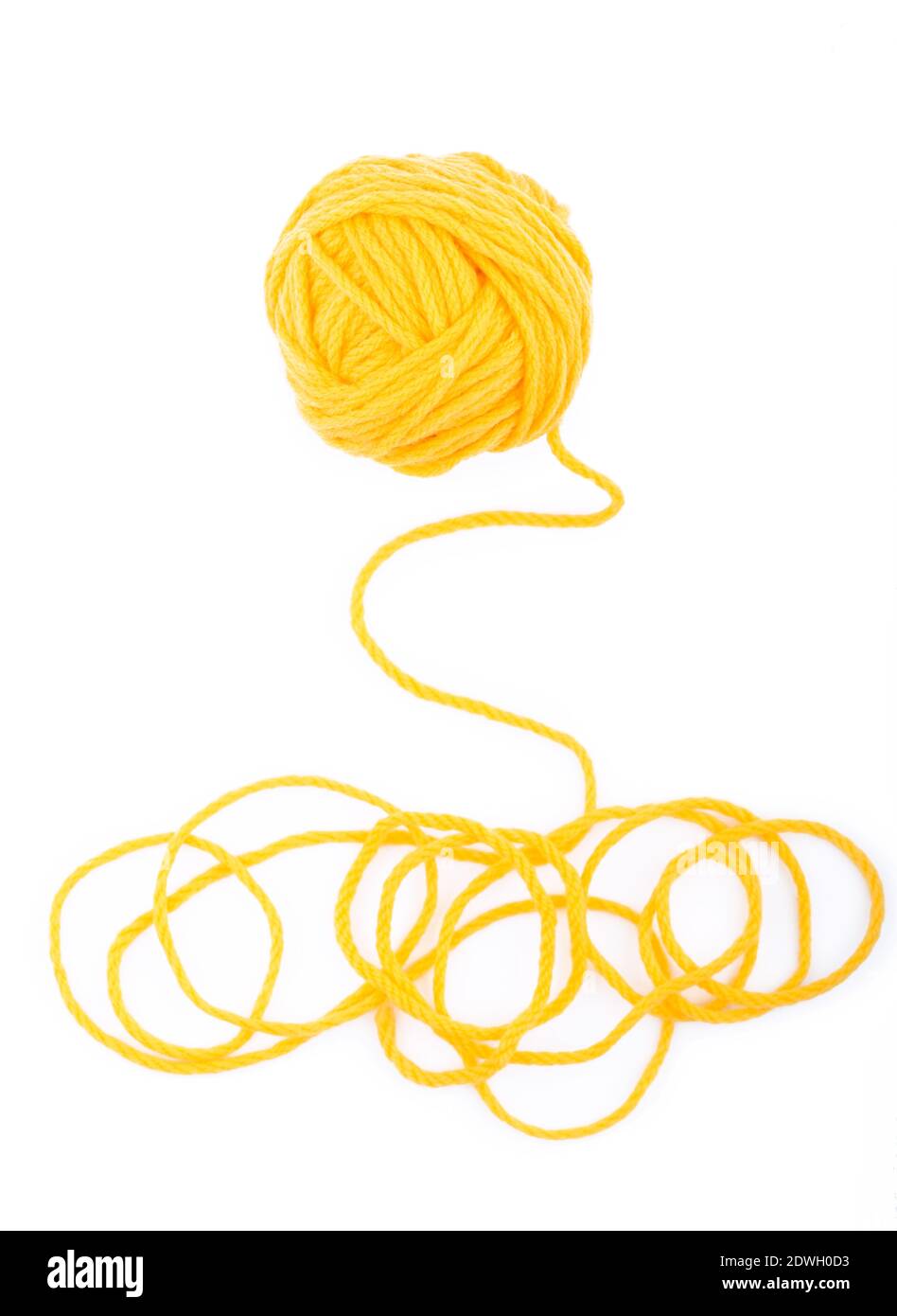The idea is a tangled thread. Yellow ball of yarn on white background ...