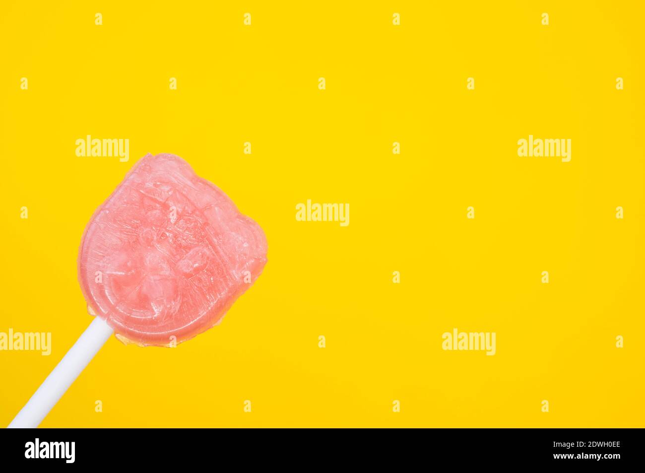 A closeup shot of yummy candy isolated on a yellow background Stock ...