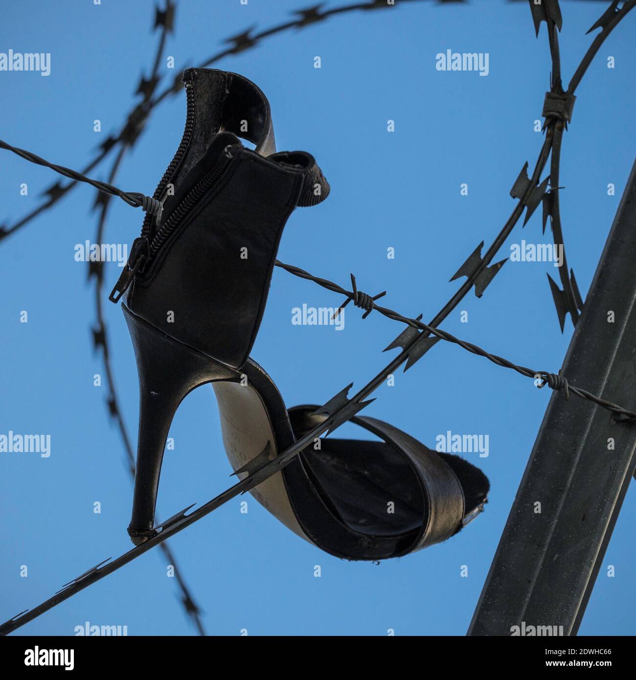 High barbed fence hi-res stock photography and images - Alamy